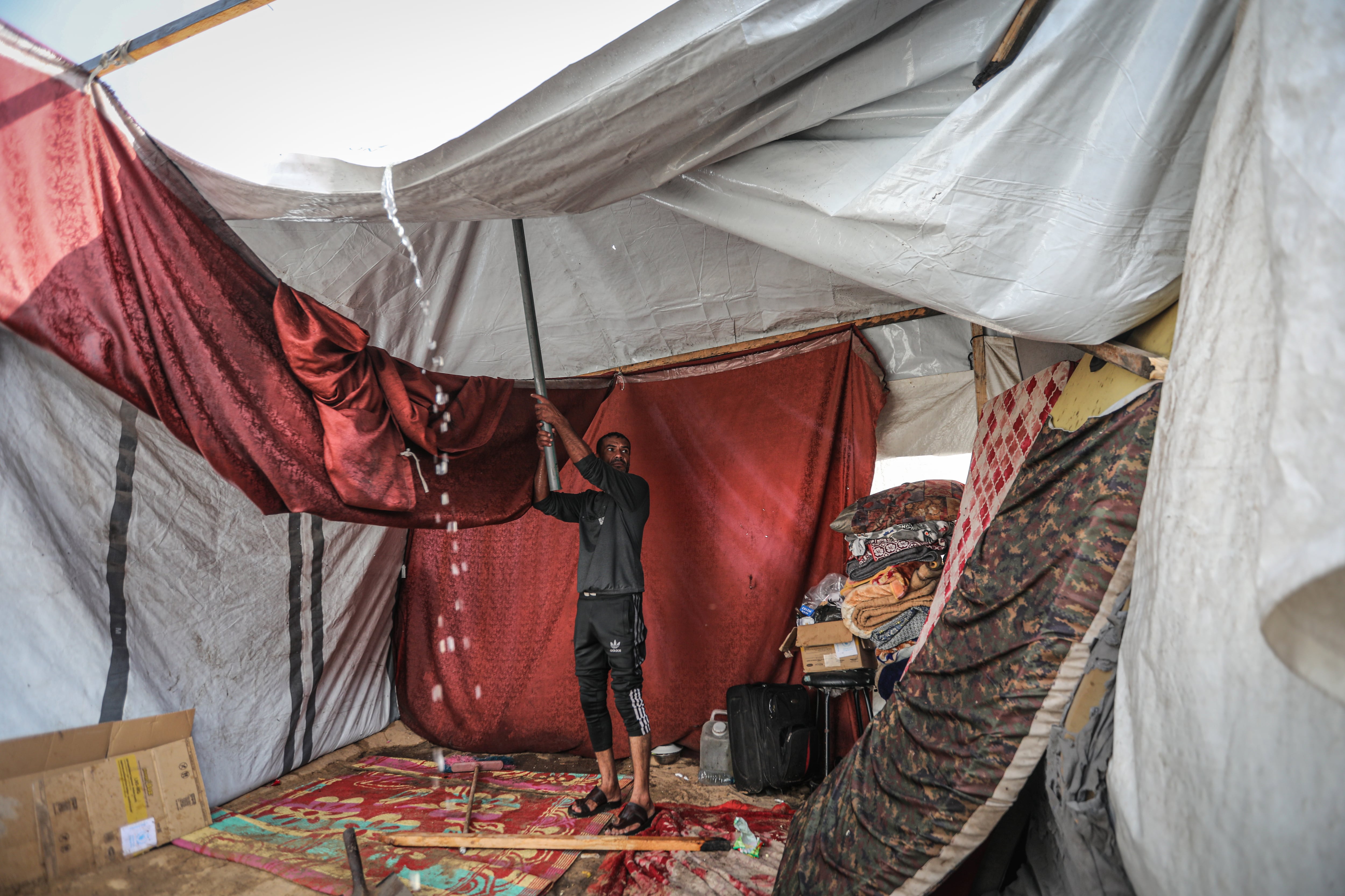Gazans fear winter in 'cold and filth' after rain floods tent cities ...