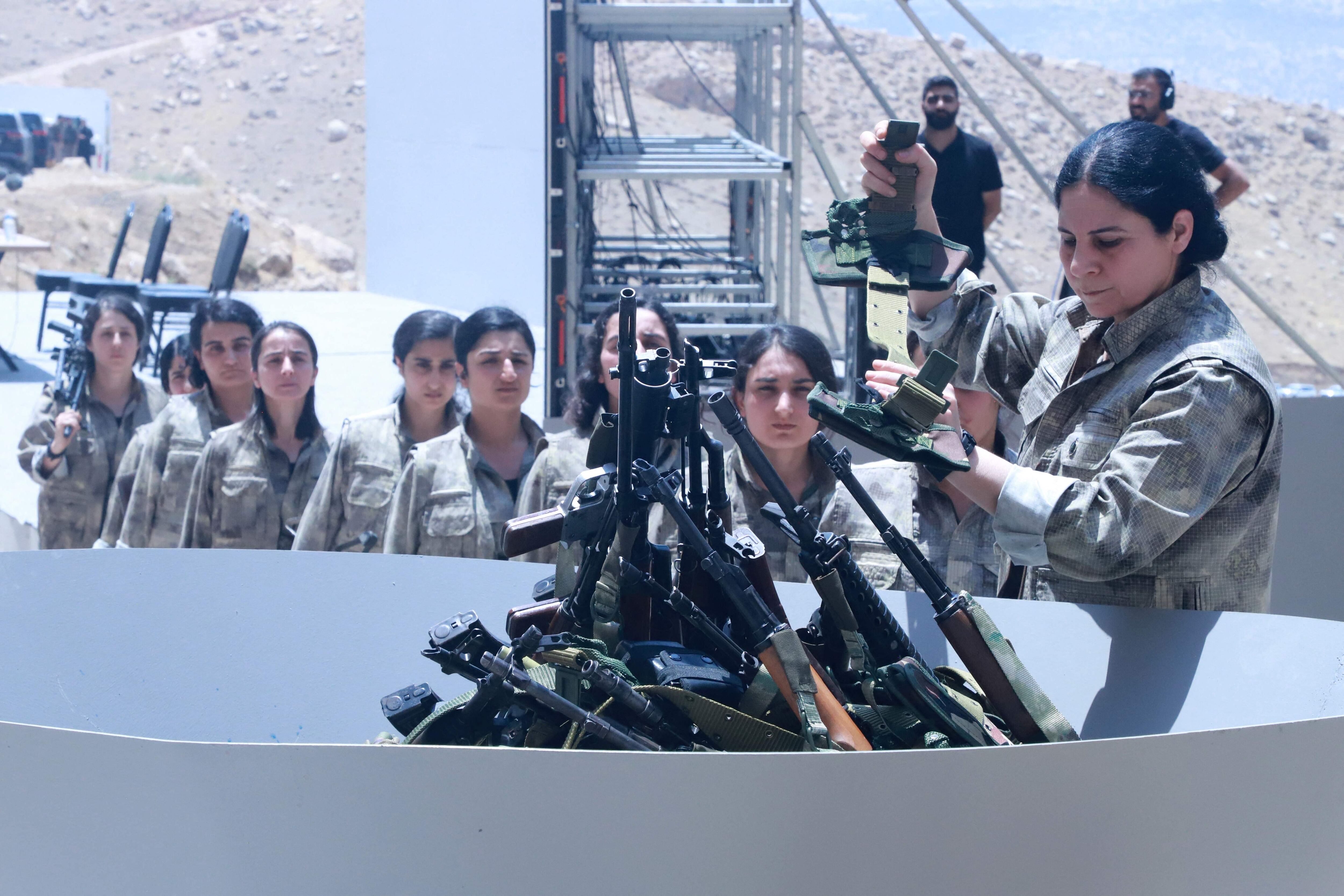 PKK fighters begin laying down weapons at symbolic ceremony | The National