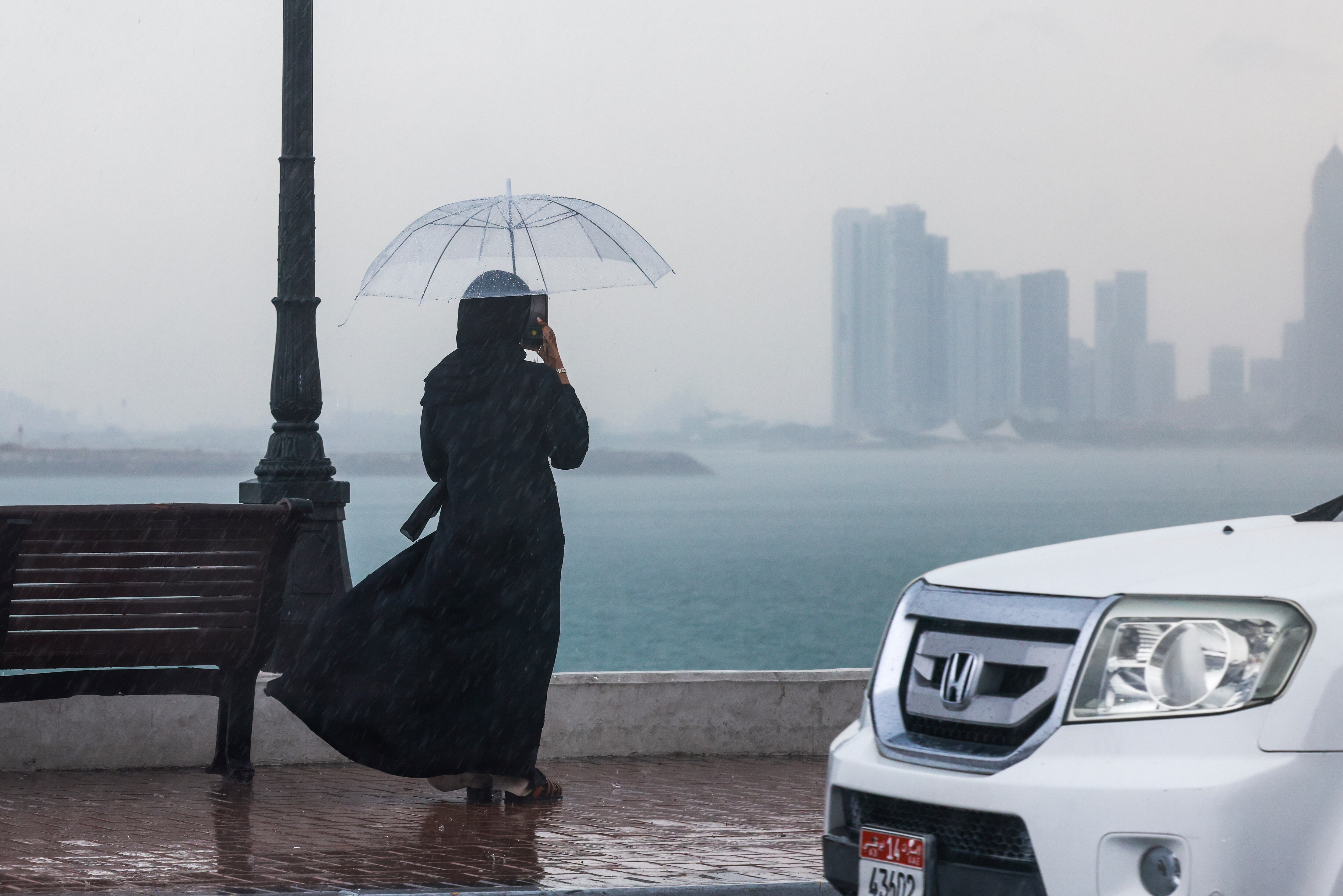 Abu Dhabi and Ajman hit by year's worth of rain in a day – with more ...